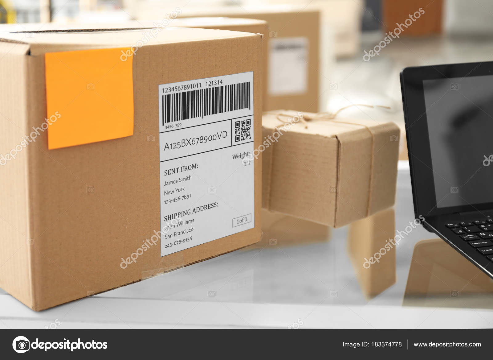 Parcels ready for shipment to customers on table in home office ...
