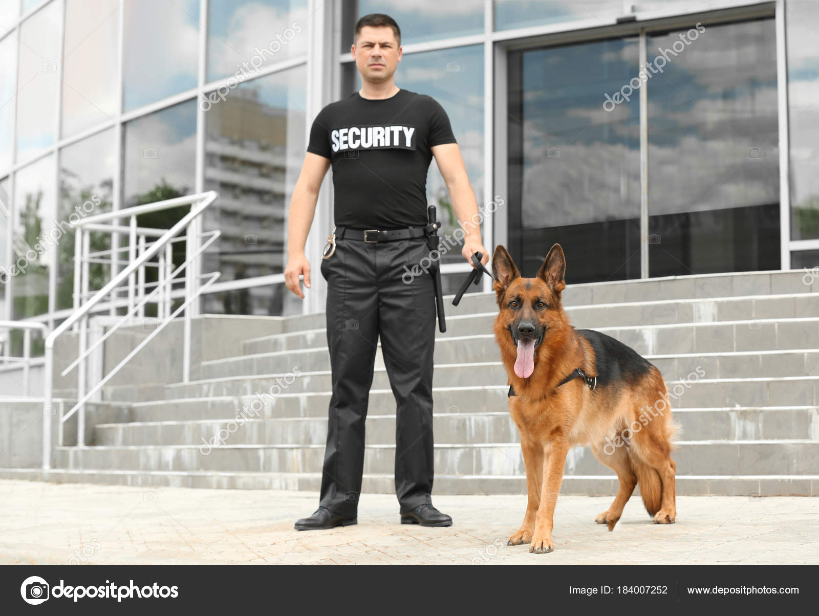 Security guard with dog Stock Photo by ©belchonock 184007252