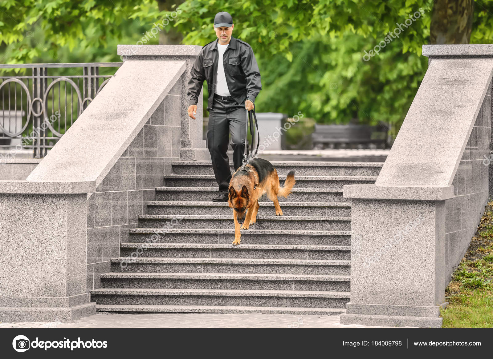 Security guard with dog Stock Photo by ©belchonock 184009798
