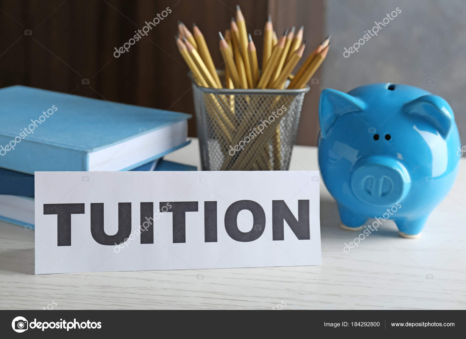 Paper with word TUITION Stock Photo by ©belchonock 184292800