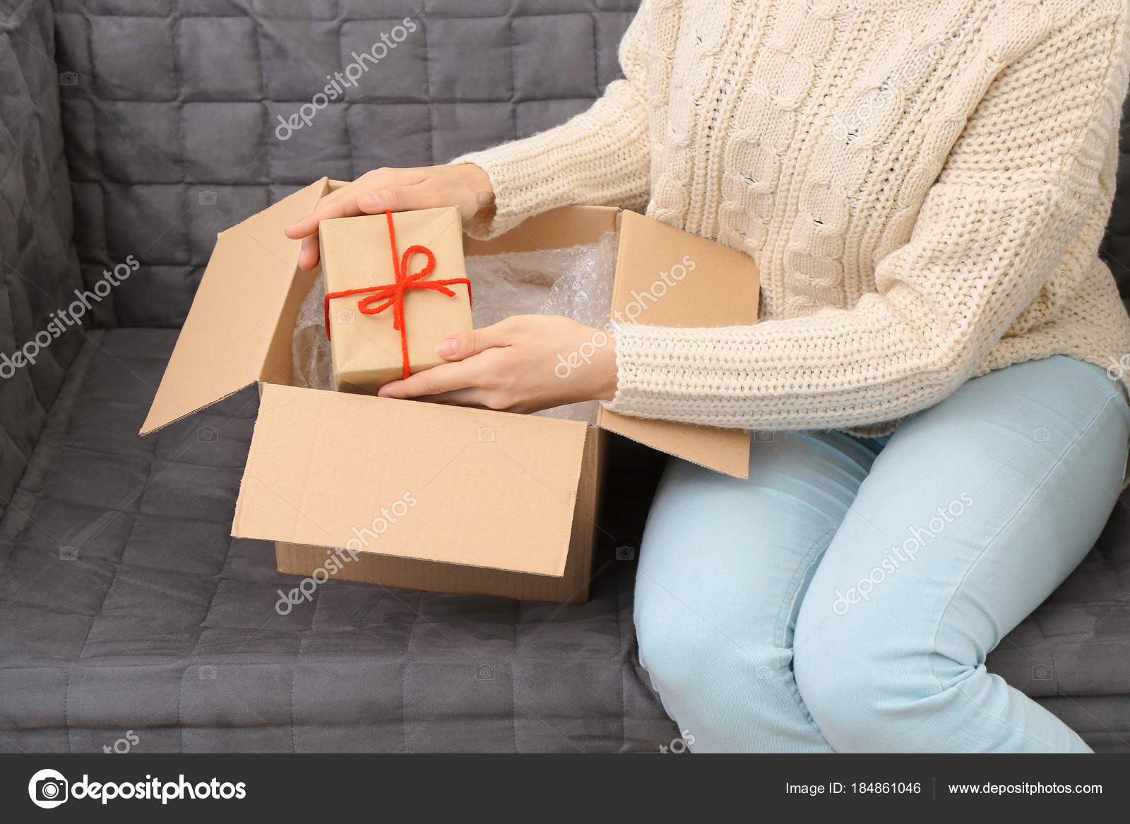 Woman taking gift box Stock Photo by ©belchonock 184861046