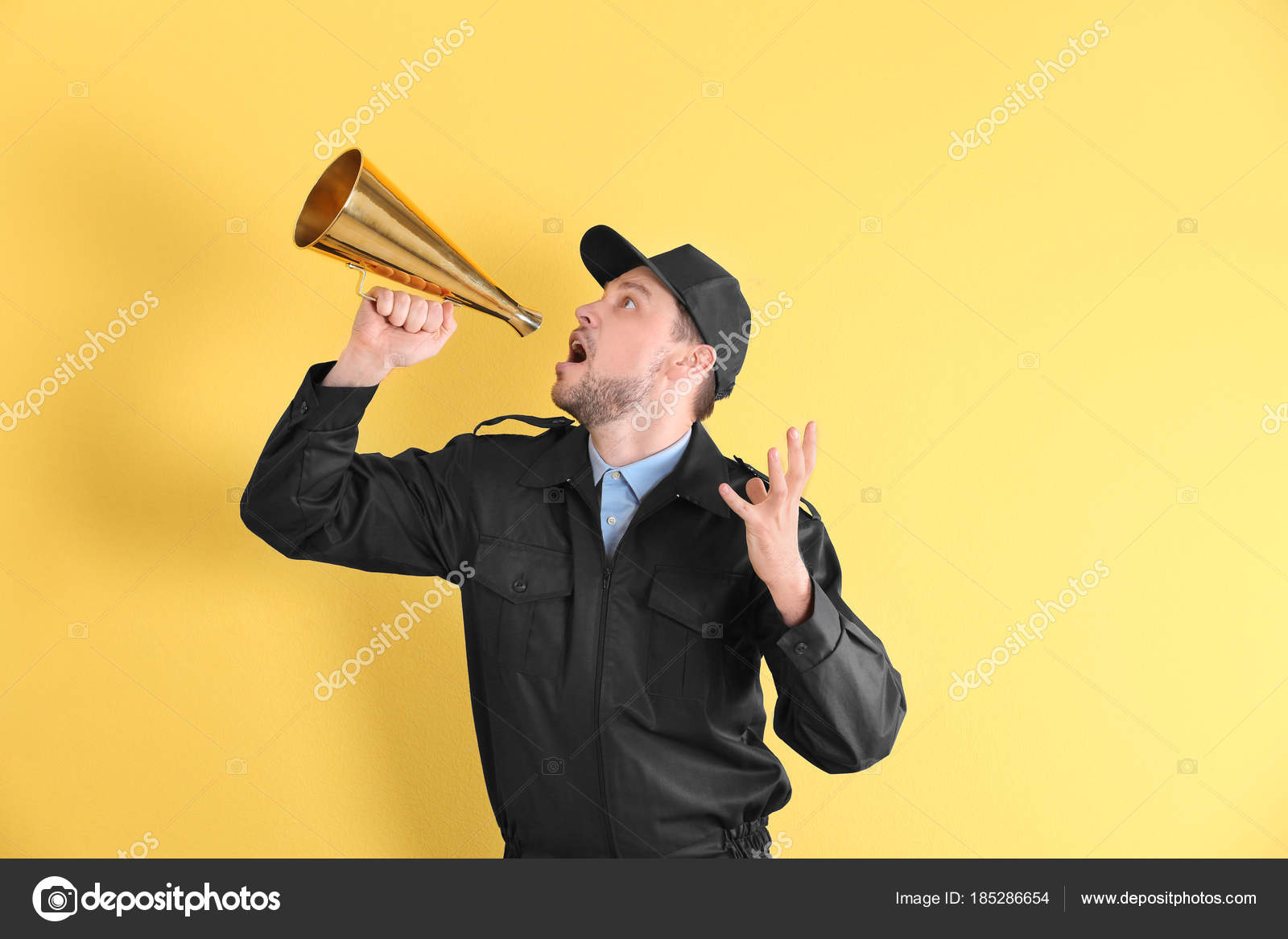 Male Security Guard Megaphone Yellow Background Stock Photo by ...