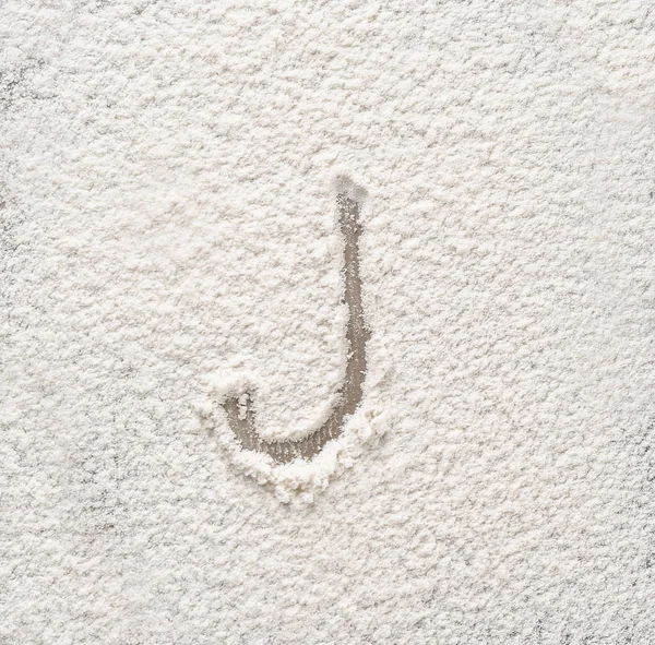 Letter R written on flour Stock Photo by ©belchonock 185883232