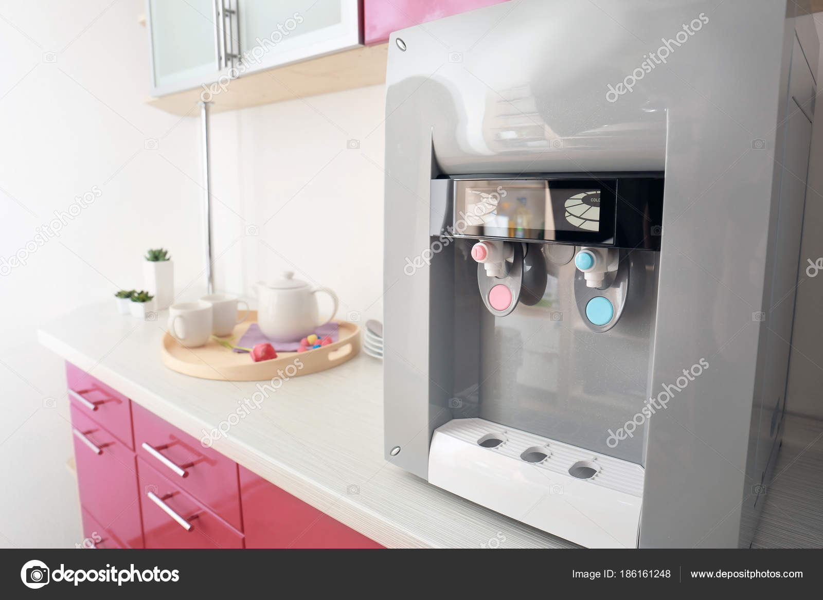 Modern water cooler on table in kitchen — Stock Photo © belchonock ...