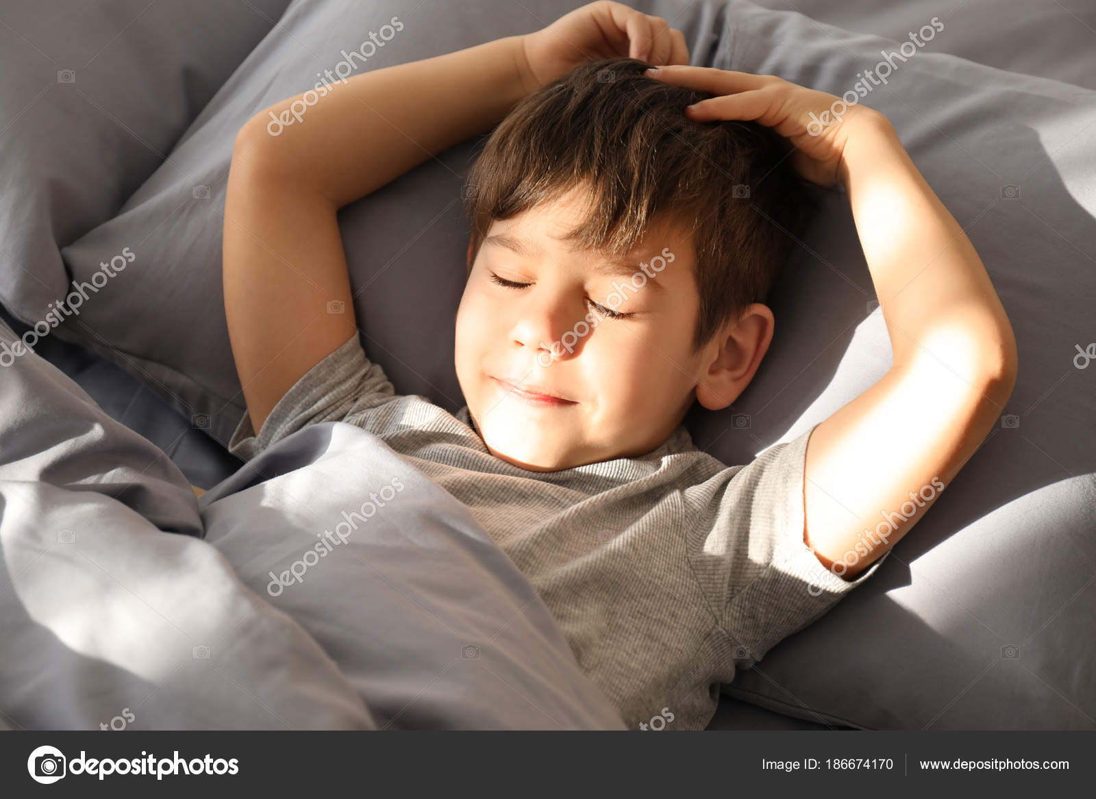 Cute little boy waking up in morning at home — Stock Photo © belchonock ...