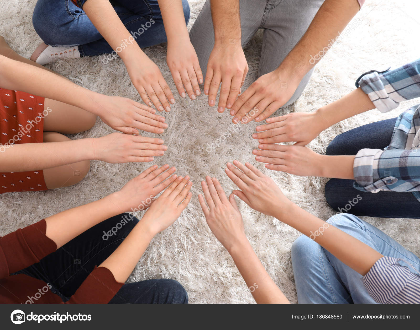 Young people making circle with hands Stock Photo by ©belchonock 186848560
