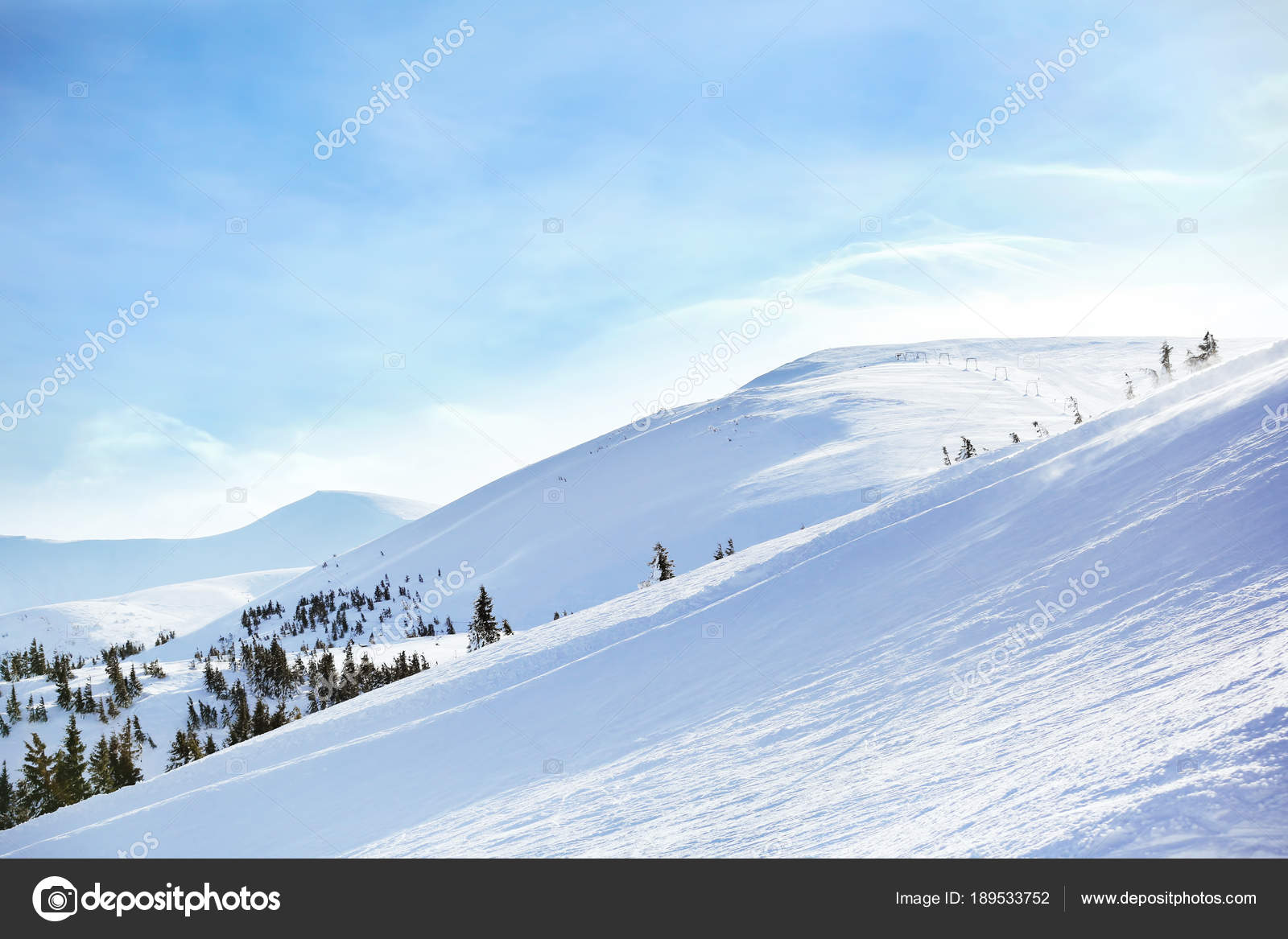 Ski slope at snowy resort Stock Photo by ©belchonock 189533752