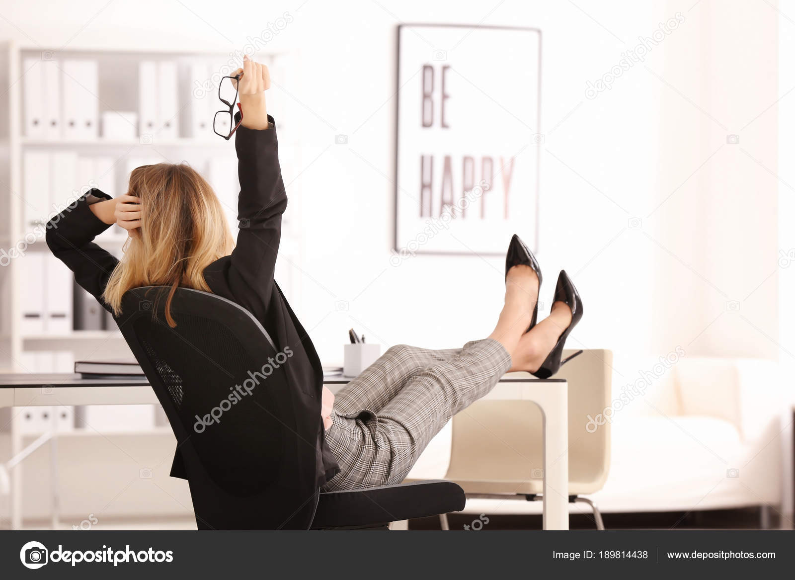 Beautiful businesswoman relaxing in office — Stock Photo © belchonock ... Beautiful businesswoman relaxing in office — Stock Photo © belchonock ...