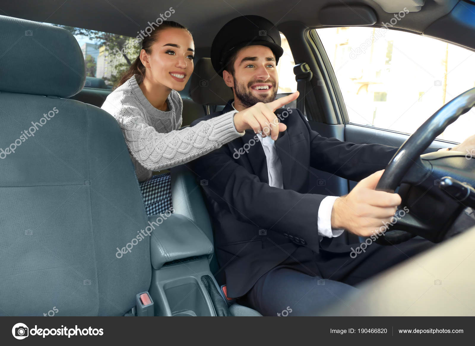 Passenger showing taxi driver way Stock Photo by ©belchonock 190466820