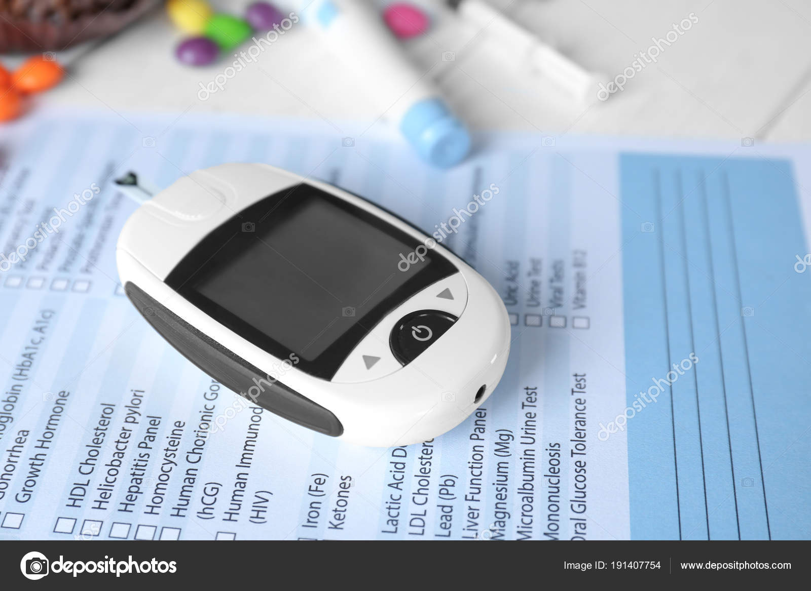 Digital glucometer on test form Stock Photo by ©belchonock 191407754