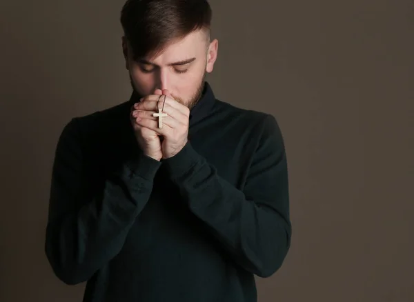 Young man praying Stock Photo by ©belchonock 192274794