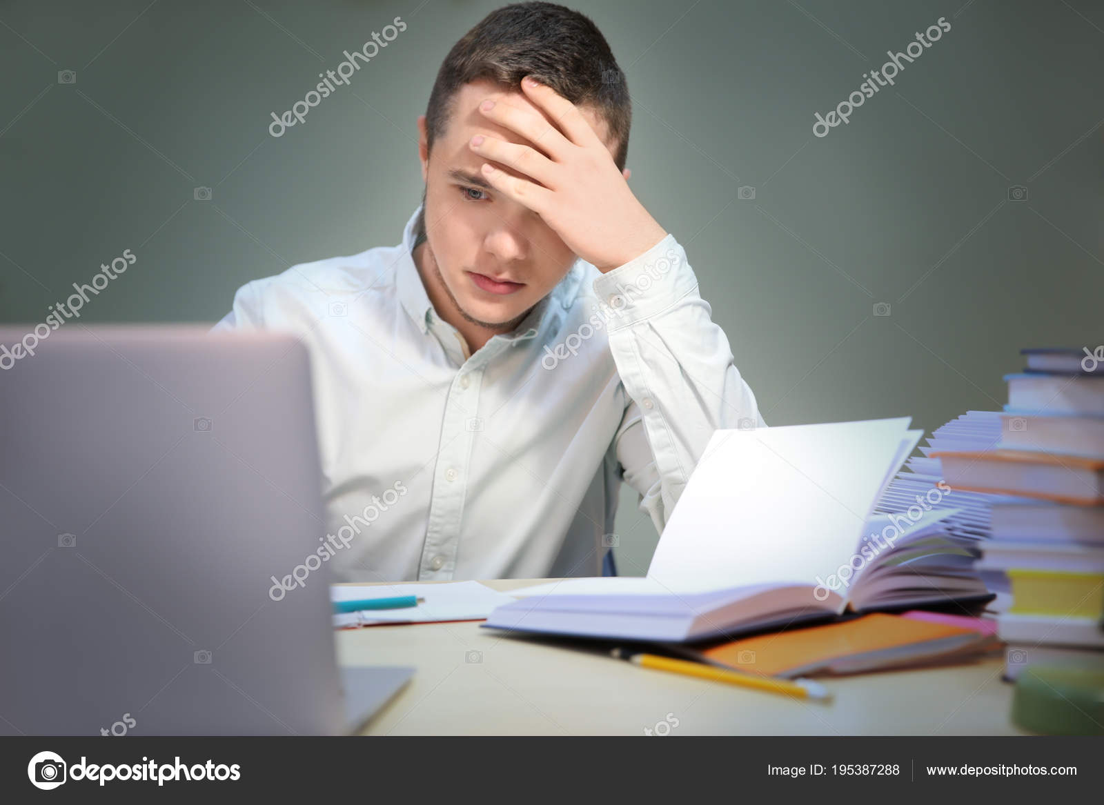Tired student doing homework Stock Photo by ©belchonock 195387288