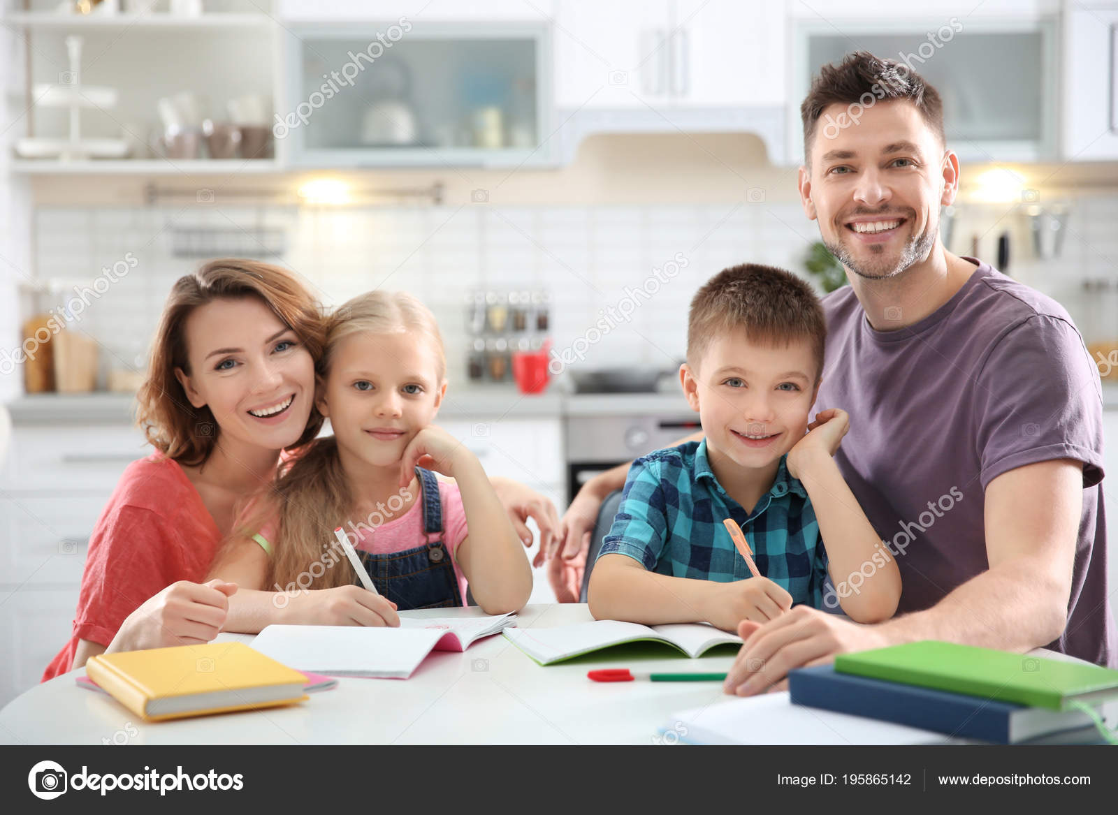 Children with parents doing homework — Stock Photo © belchonock #195865142