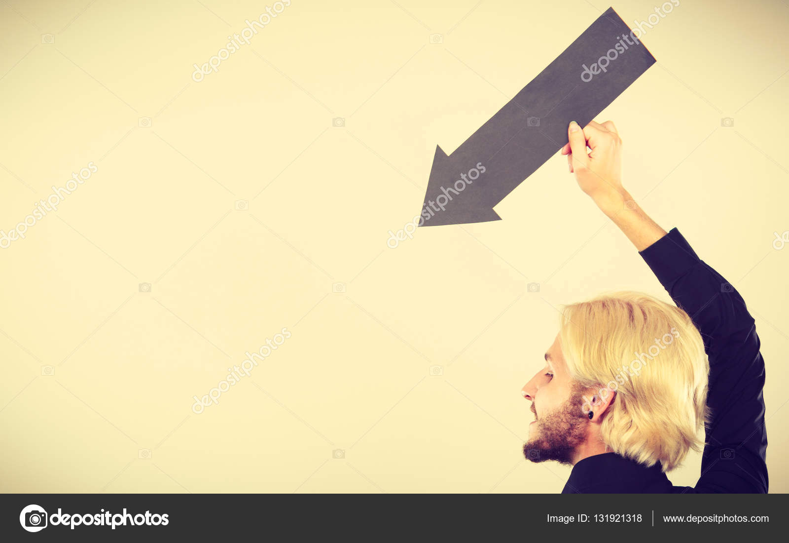 Man holding black arrow pointing left down Stock Photo by ©Anetlanda ...