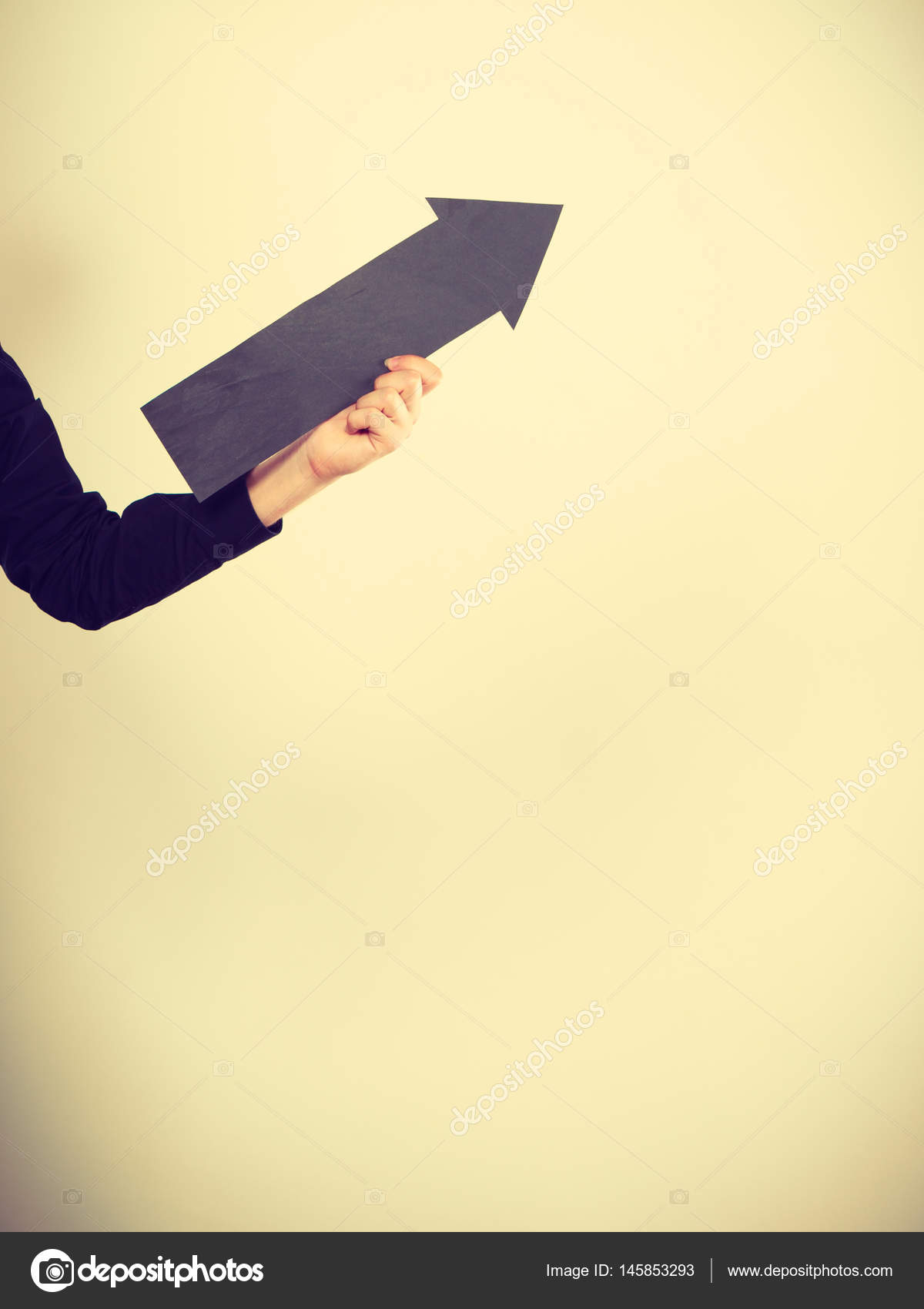 Man holding black arrow pointing right — Stock Photo © Anetlanda #145853293