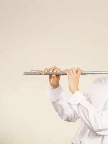 Flute music instrument in hands of flutist musician - Stock Image ...