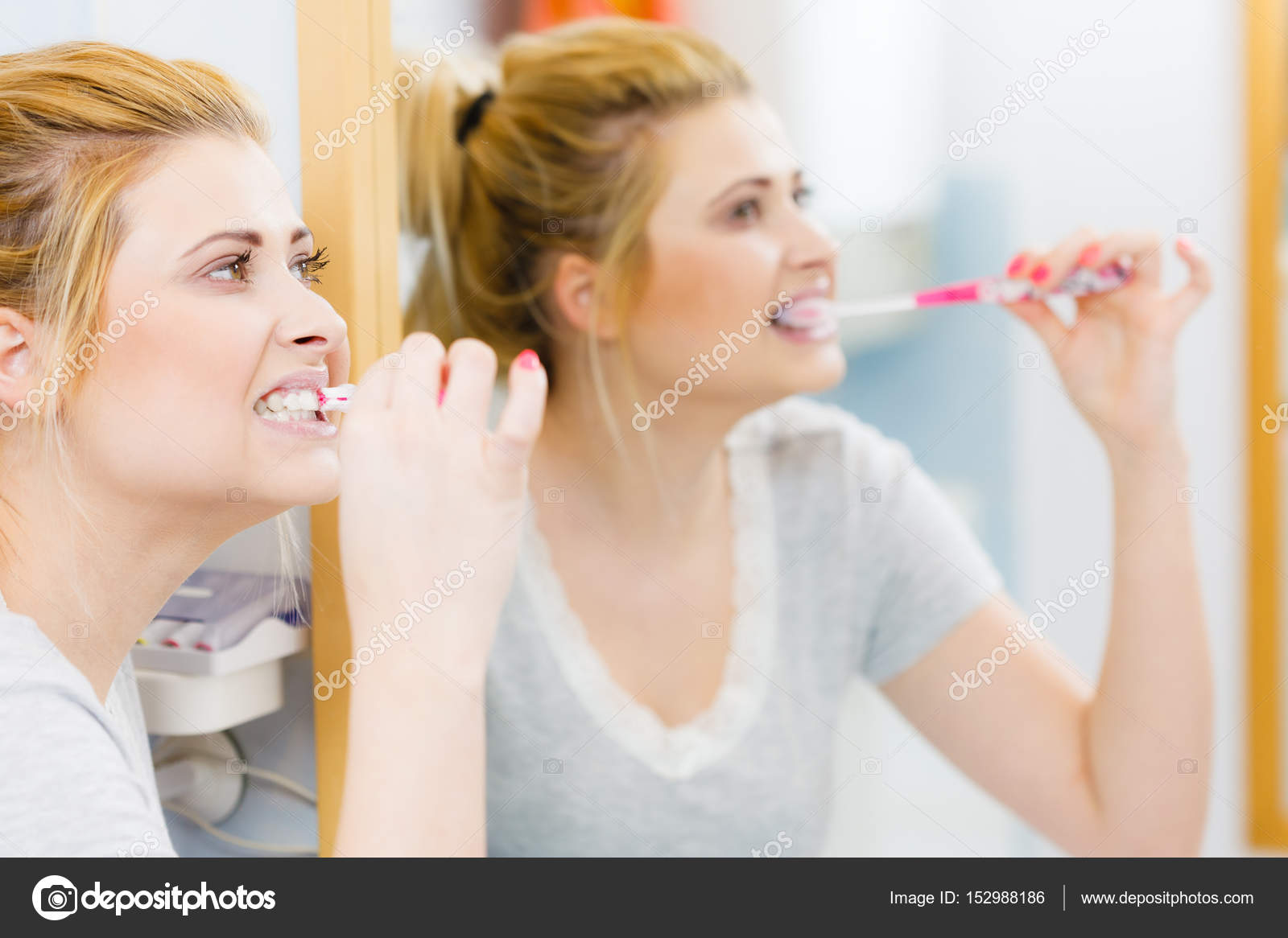 Woman brushing cleaning teeth in bathroom Stock Photo by ©Anetlanda ...