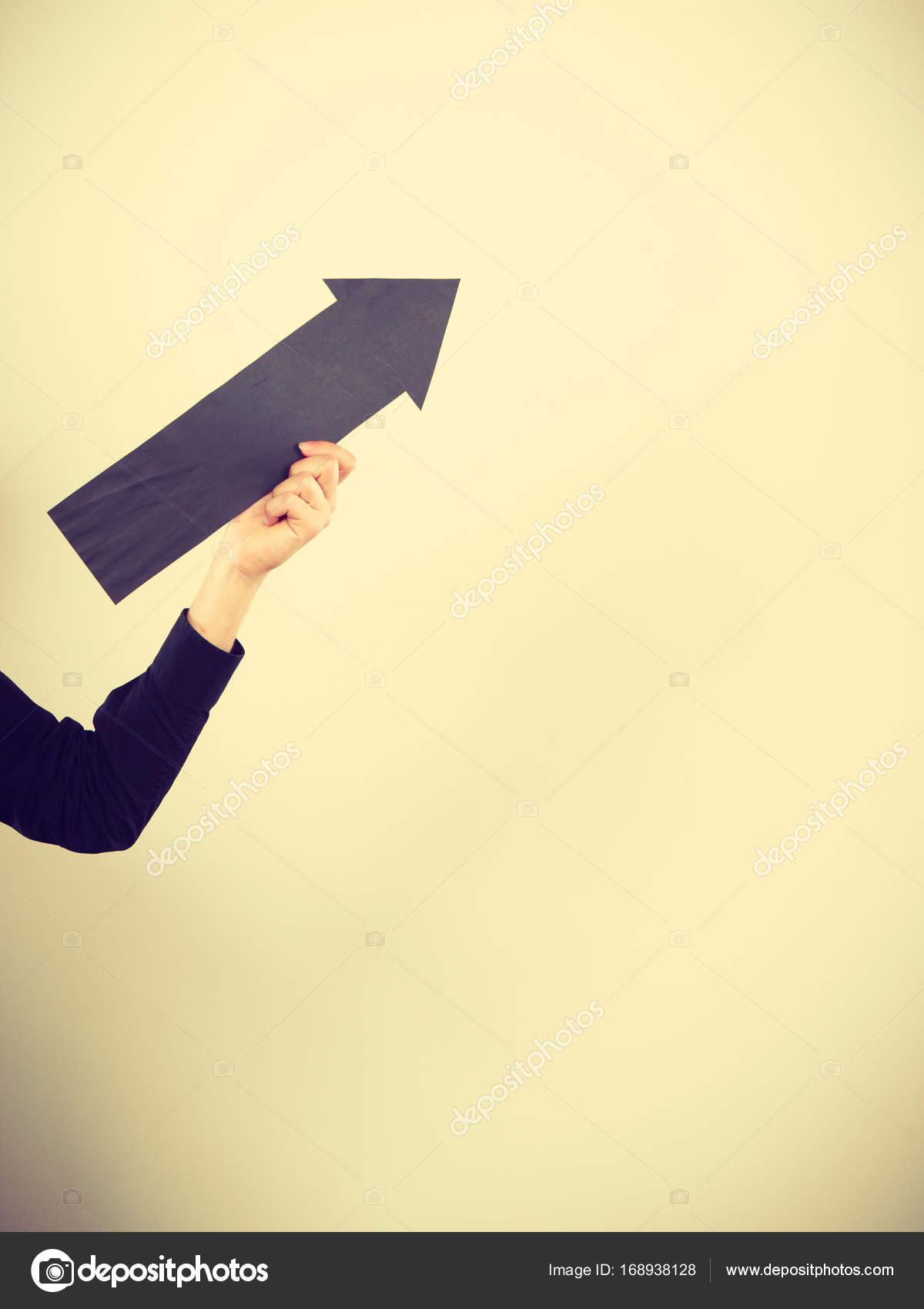 Man holding black arrow pointing right Stock Photo by ©Anetlanda 168938128