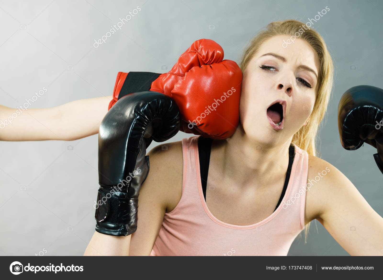 Woman getting punched in boxing fight — Stock Photo © Anetlanda #173747408
