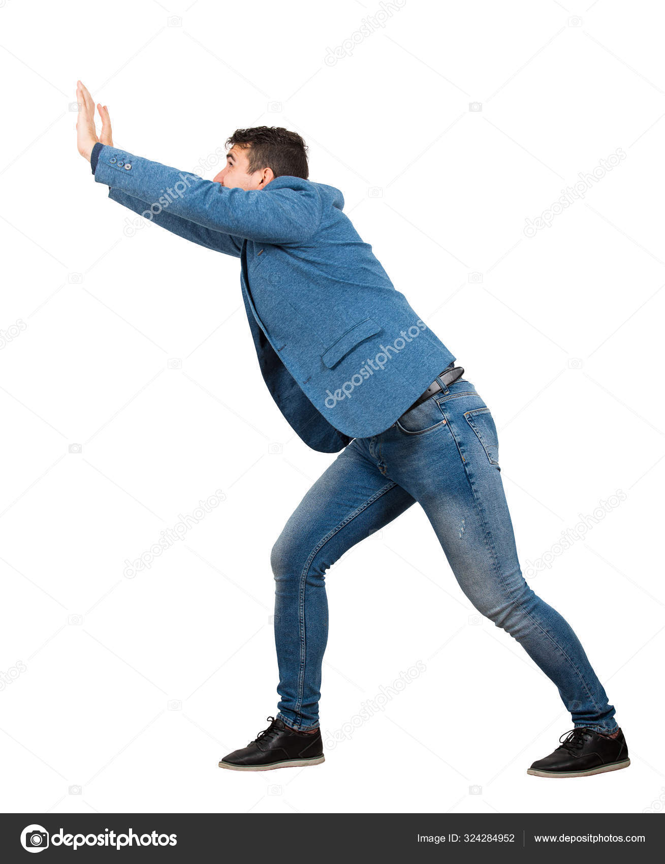 Determined young manmaking effort as pushing an heavy invisible — Stock ...