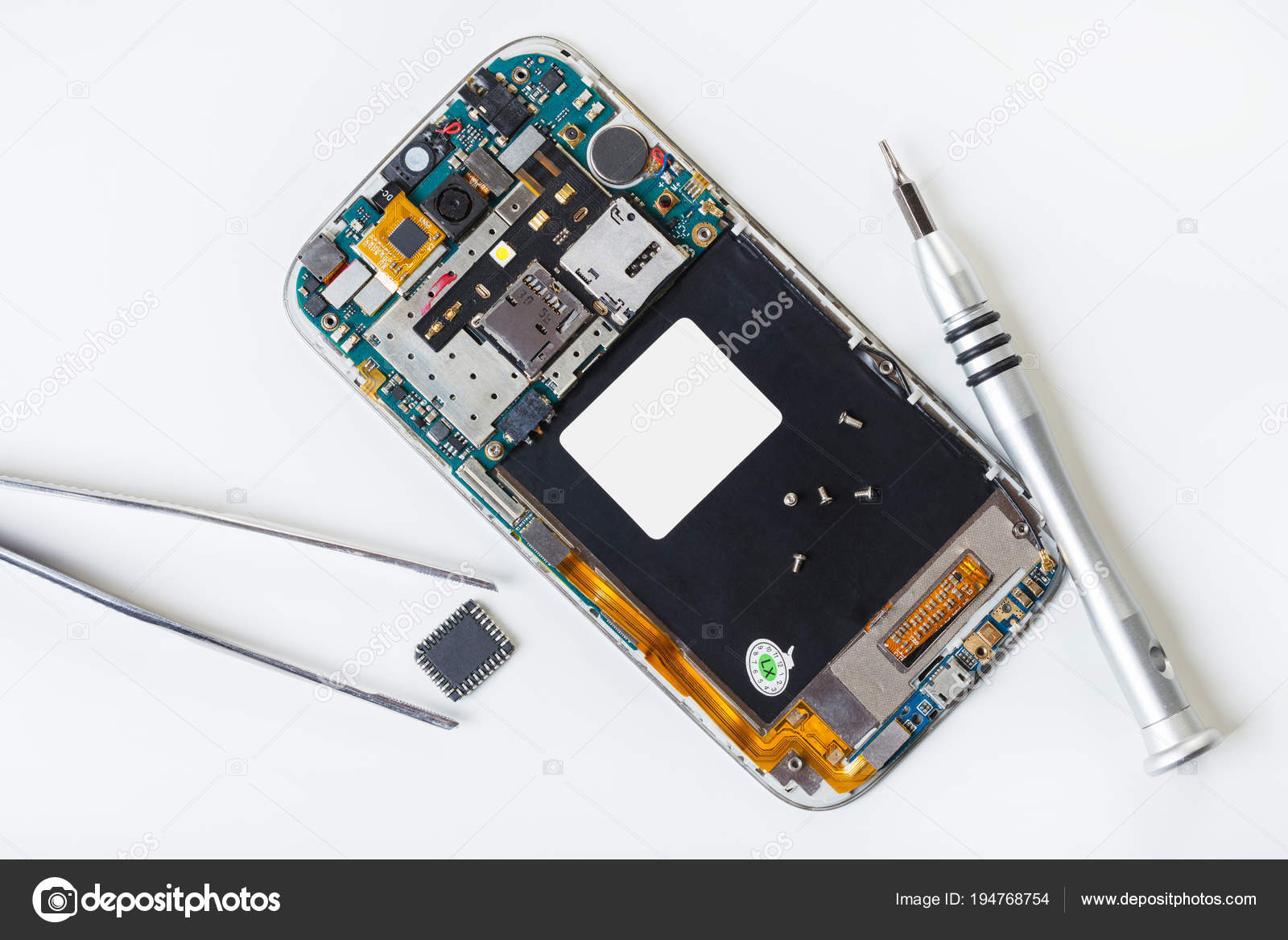 Disassembled mobile phone and tools Stock Photo by ©JamaL1977a 194768754
