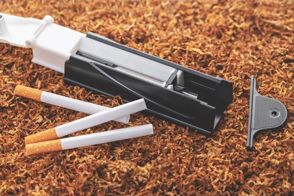 Cigarette rolling machine Stock Photos, Royalty Free Cigarette rolling ...