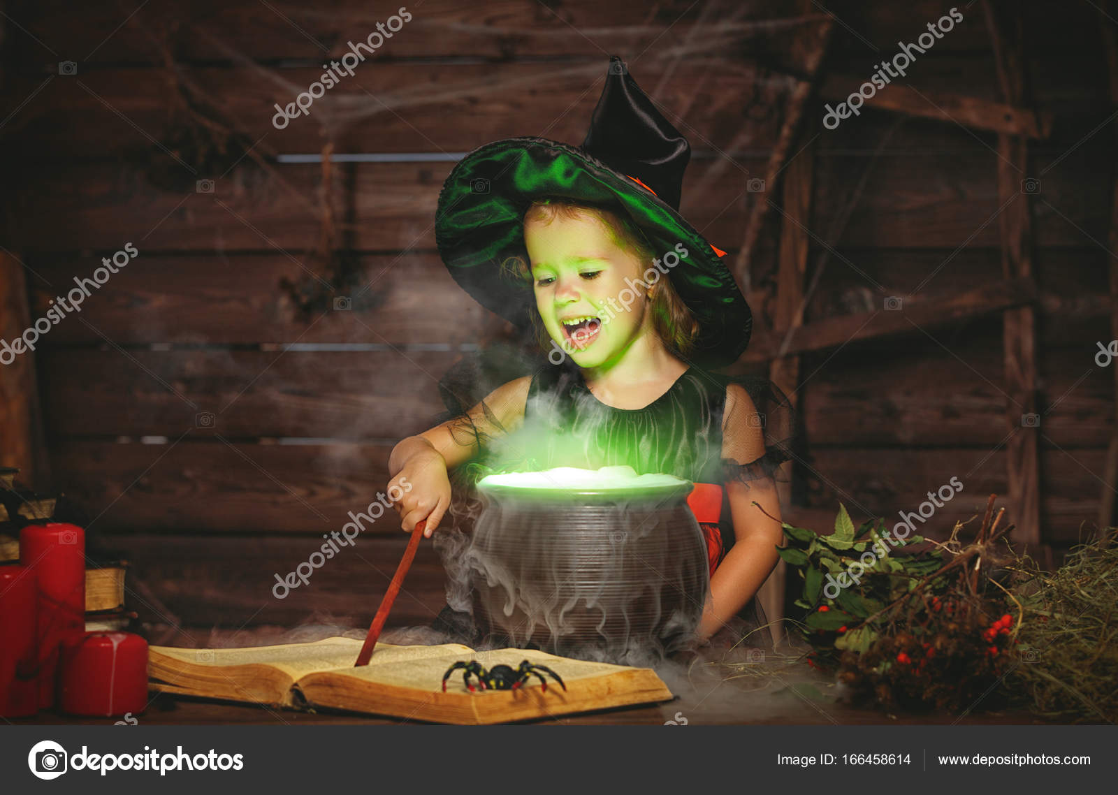 Halloween. little witch child cooking potion in cauldron with — Stock ...