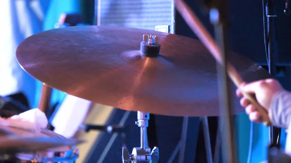 The drum stick hit on the crash cymbal in the low key. Drummer hits the ...