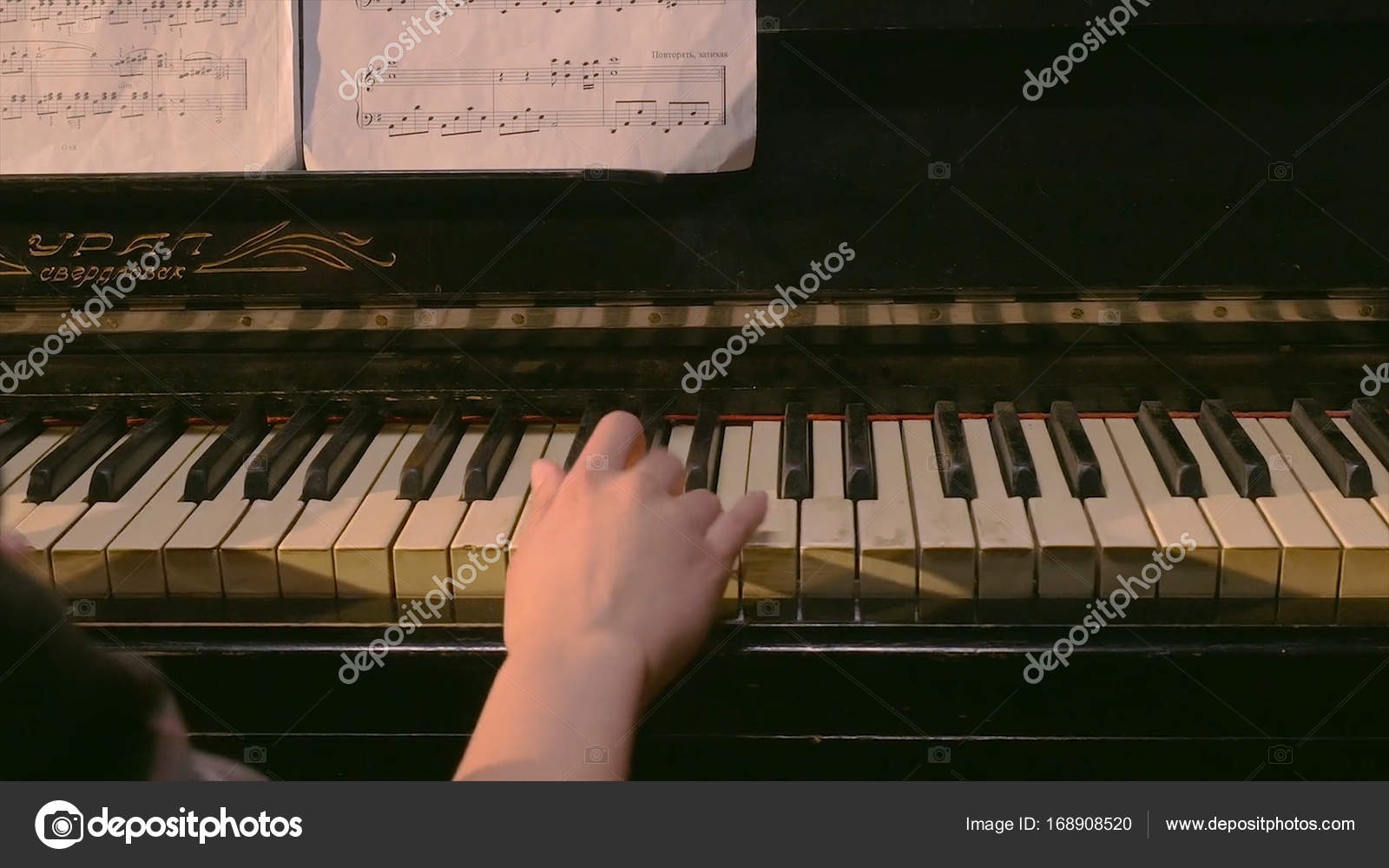 Closeup womans hand playing piano. Favorite classical music. Playing ...