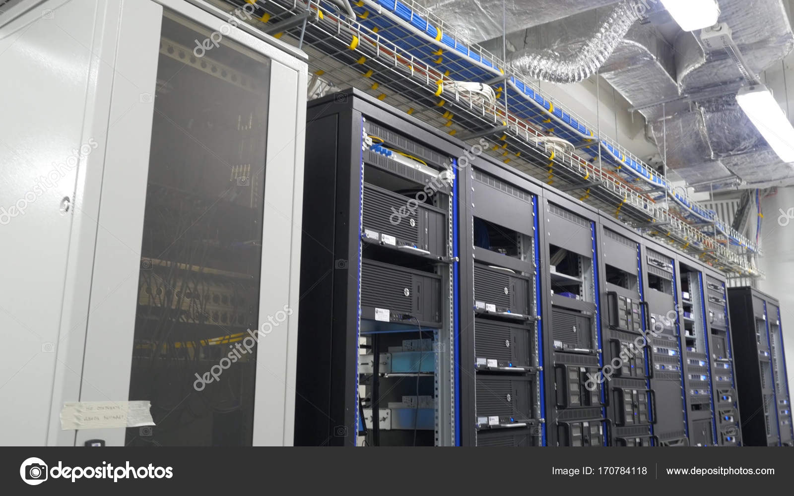 Many powerful servers running in the data center server room. Many ...