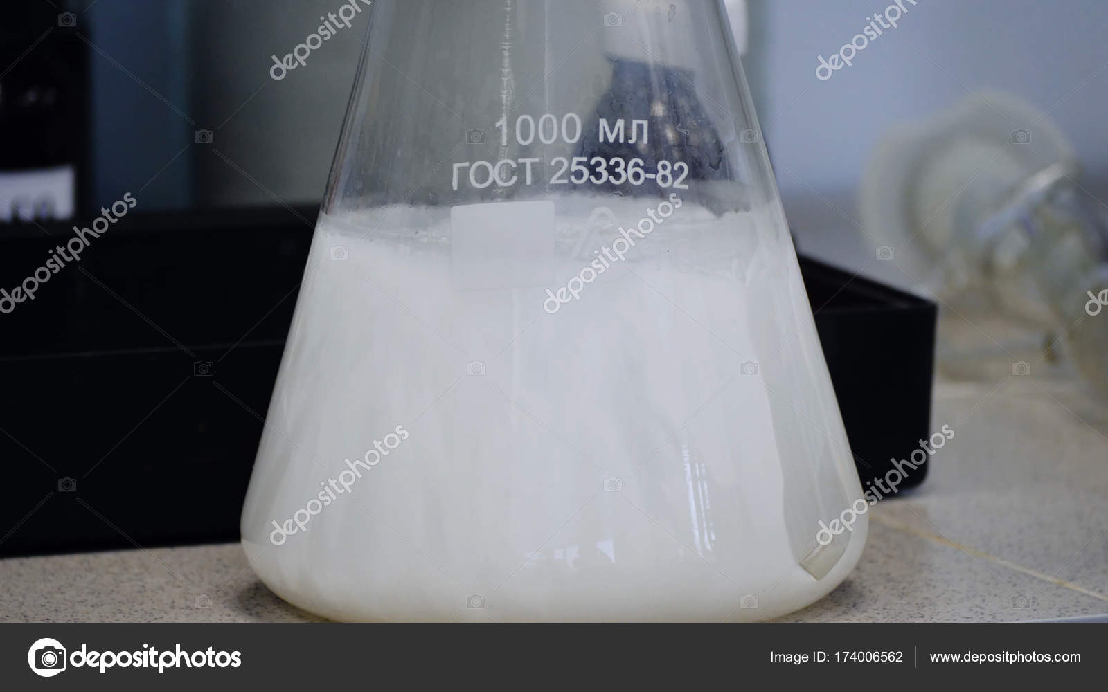 Laboratory glass Erlenmeyer conical flask filled with chemical white ... Laboratory glass Erlenmeyer conical flask filled with chemical white ...