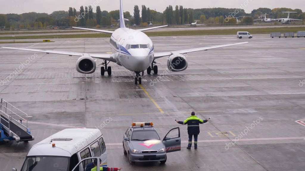 Ground Crew Worker Man Standing and Marshalling Directing an Aircraft ...