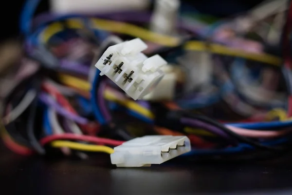 Old entangled cables, electronics and old cable connectors on a - Stock ...