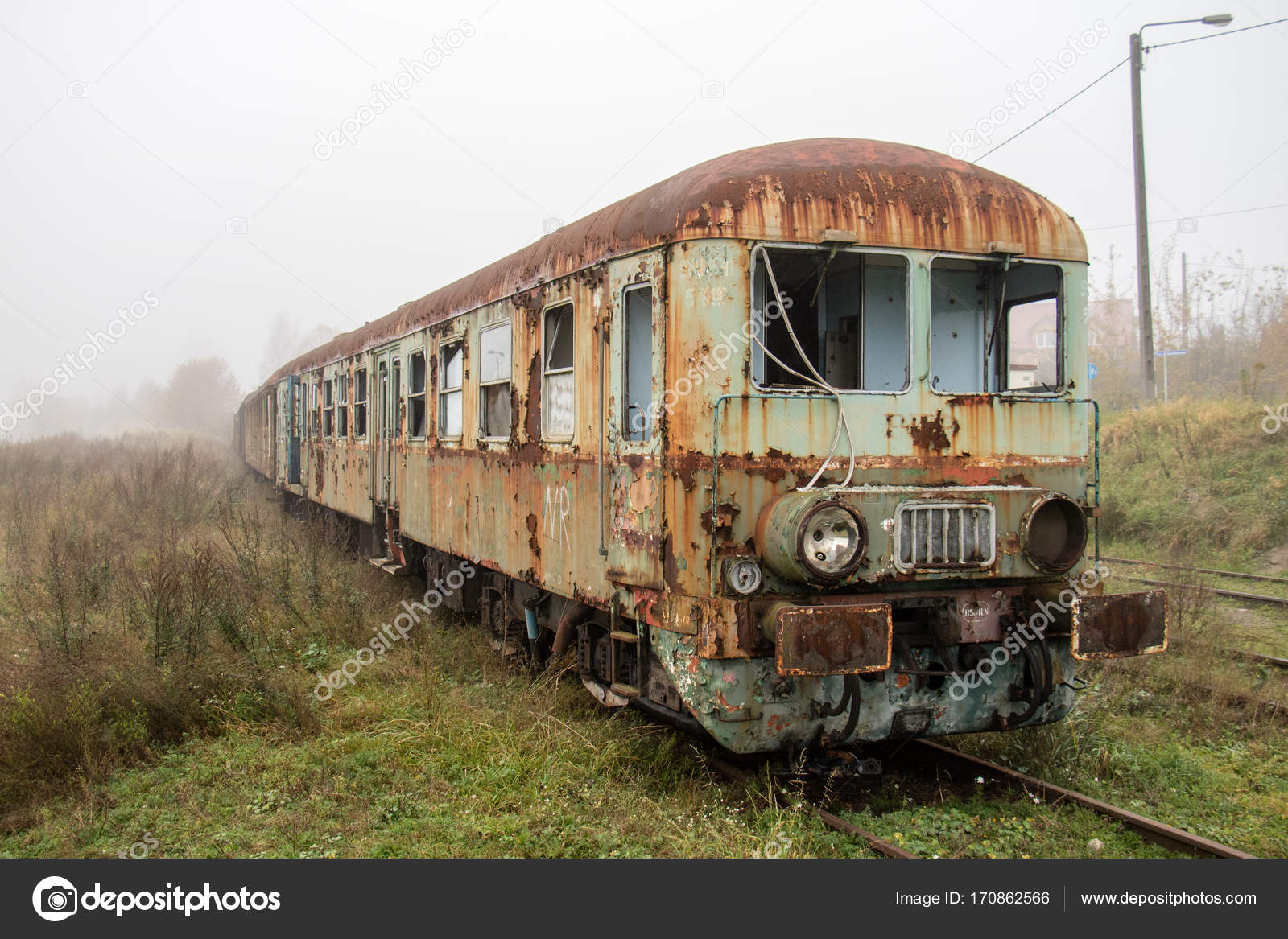 Old rusty trains. Old abandoned track, siding with dirty old tra ...