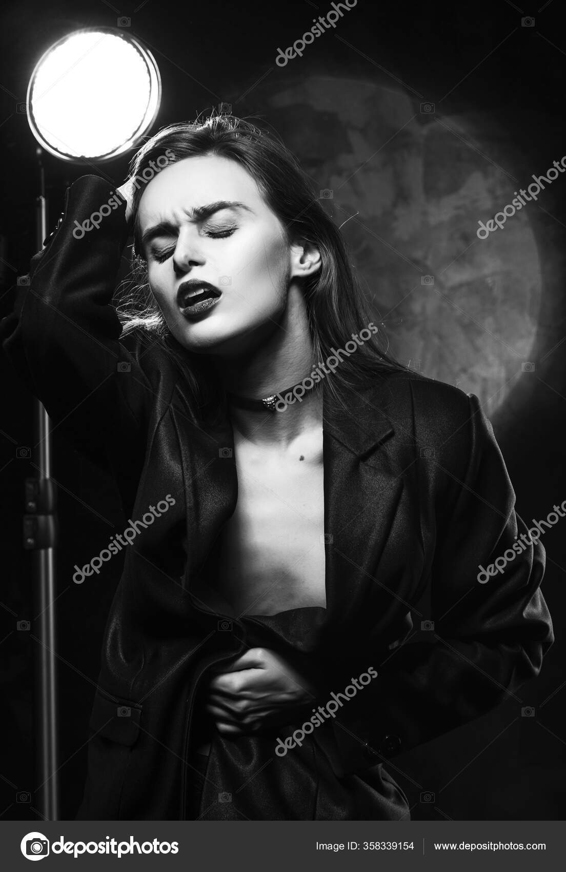 Beautiful Slim Braless Girl Wearing Unbuttoned Black Blazer Sensually