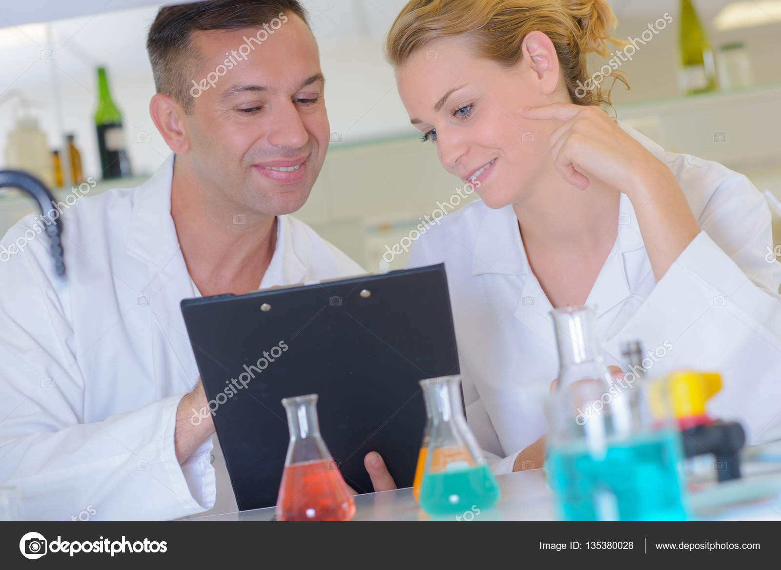 Scientist reading a report Stock Photo by ©photography33 135380028