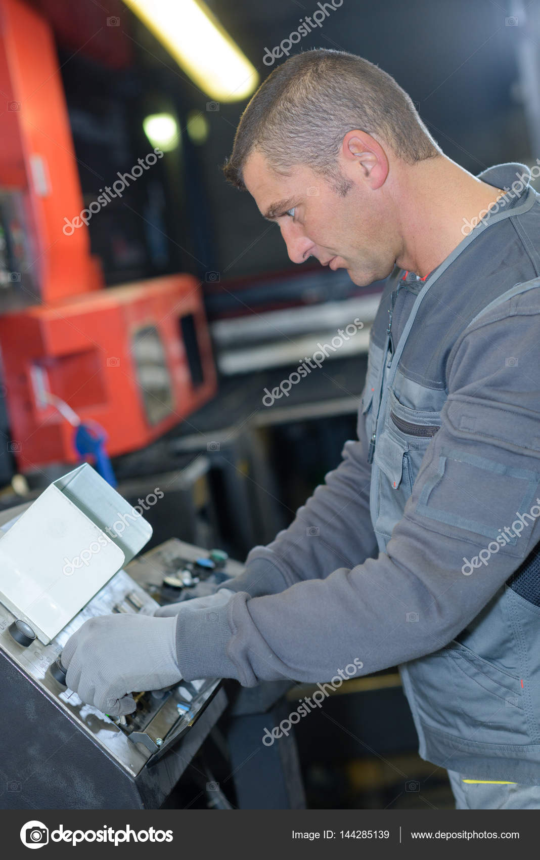 Industrial engineer inspecting a machine Stock Photo by ©photography33 ...