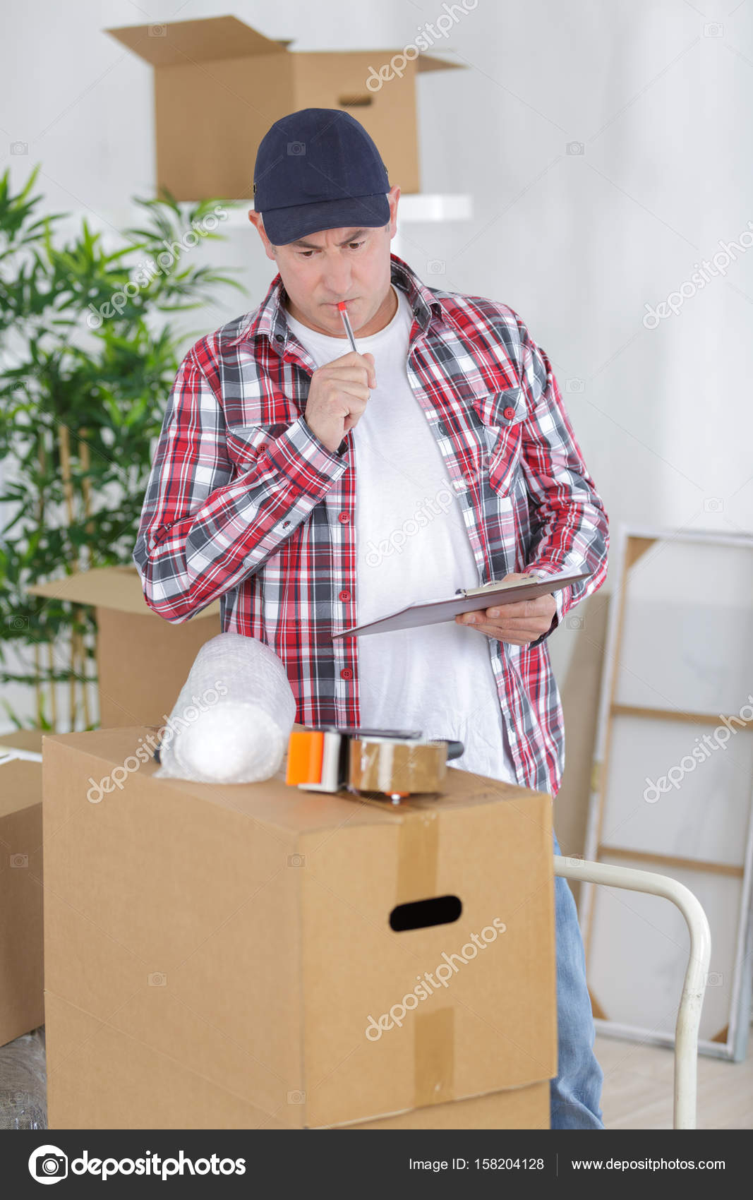 Male worker checking a box Stock Photo by ©photography33 158204128