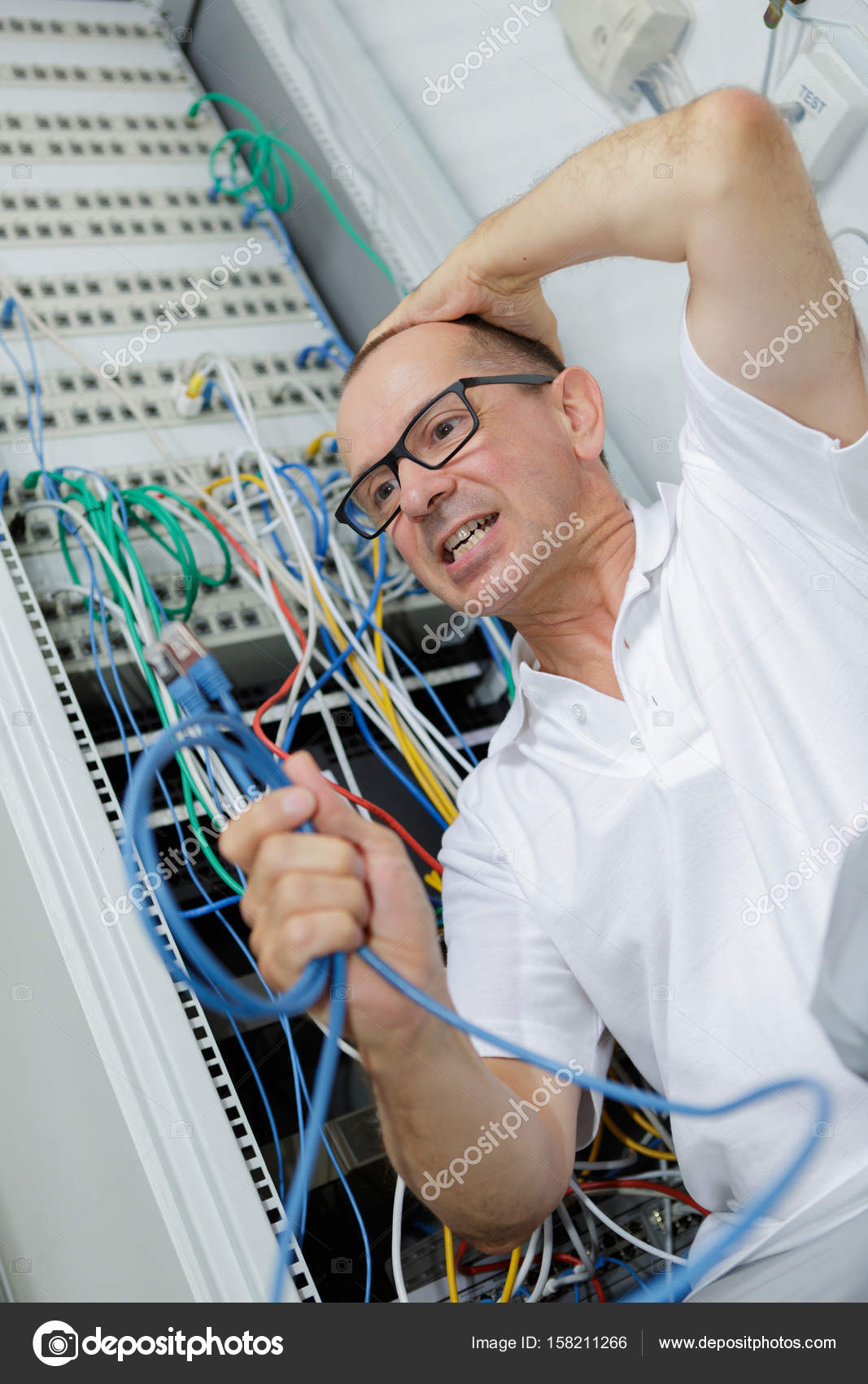 Frustrated man holding cables Stock Photo by ©photography33 158211266