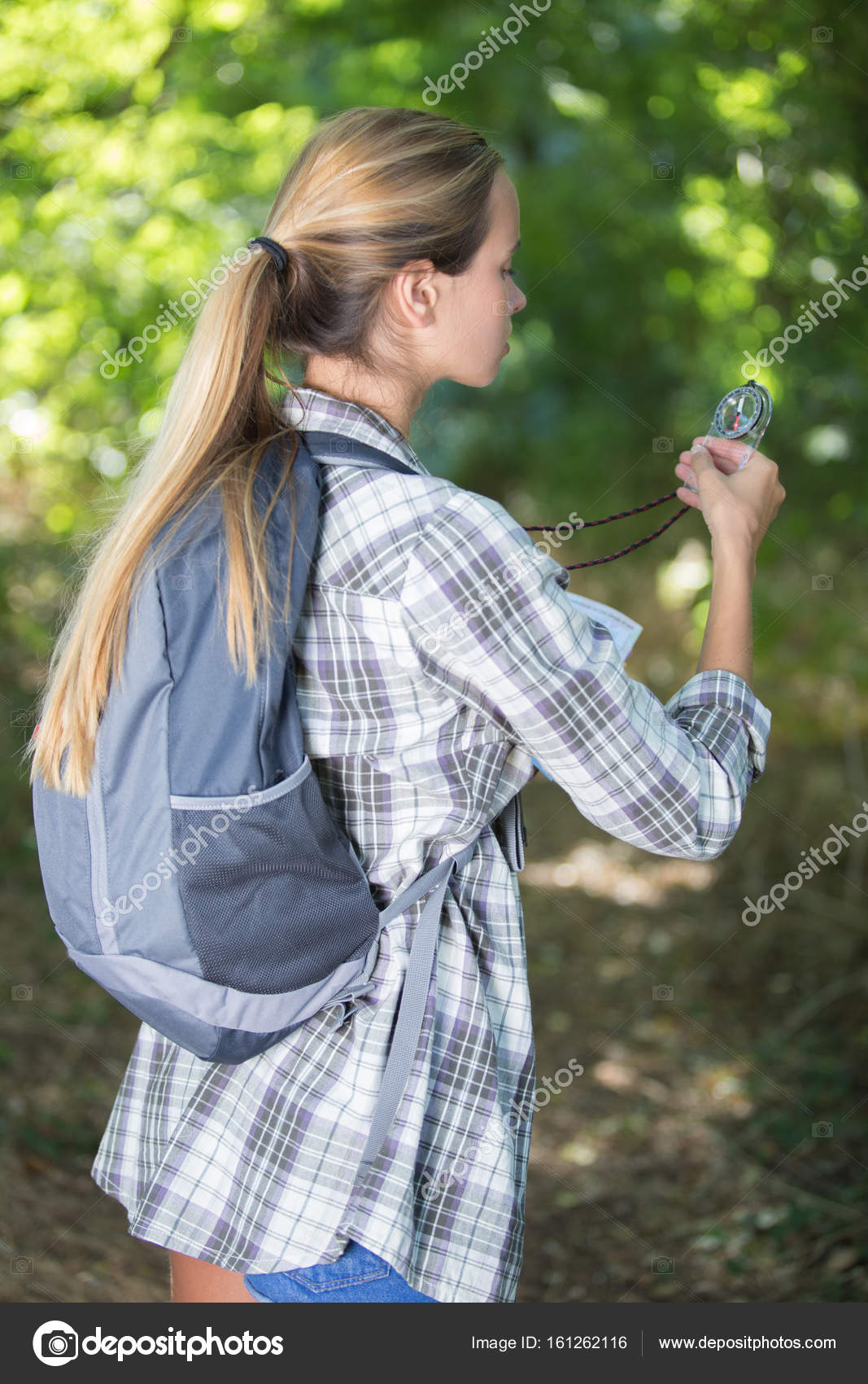 Woman on forestwith compass — Stock Photo © photography33 #161262116