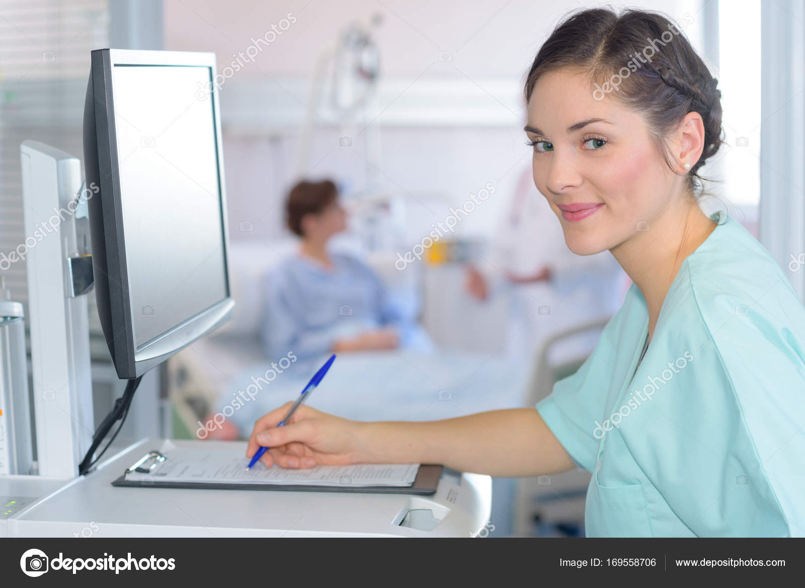 Nurse with clipboard at computer — Stock Photo © photography33 #169558706