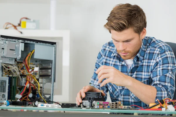 Man fixing computer Stock Photos, Royalty Free Man fixing computer ...