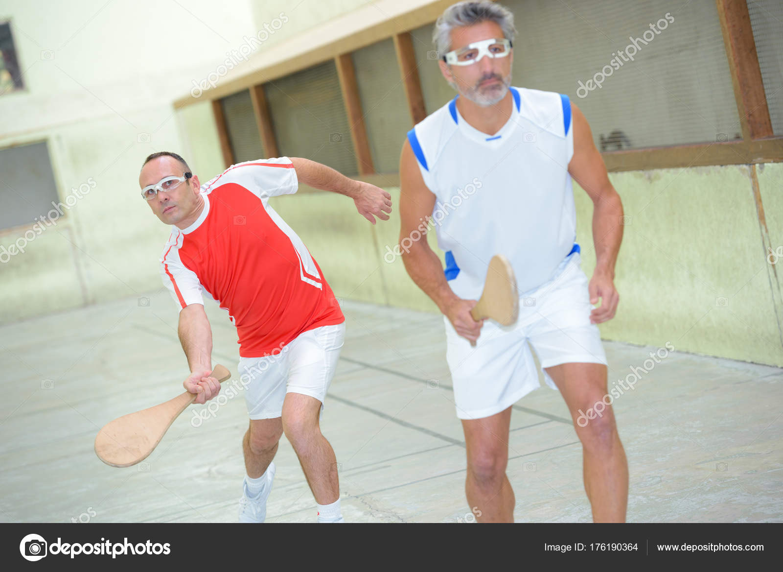 Men playing pala and sport — Stock Photo © photography33 #176190364
