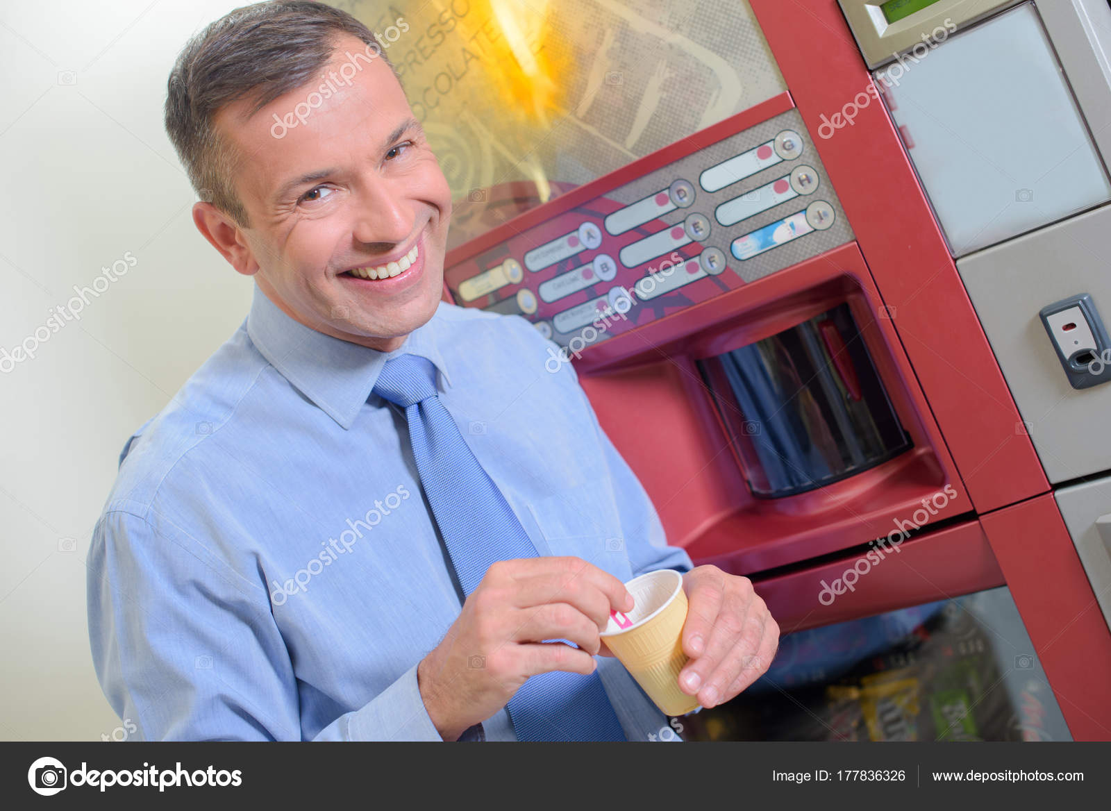 Man getting coffee from a vending machine — Stock Photo © photography33 ...