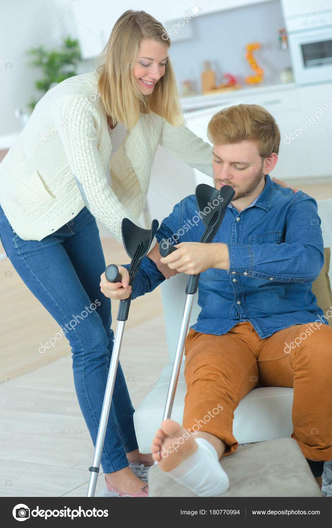 Disabled man on crutches with help of a friend Stock Photo by ...