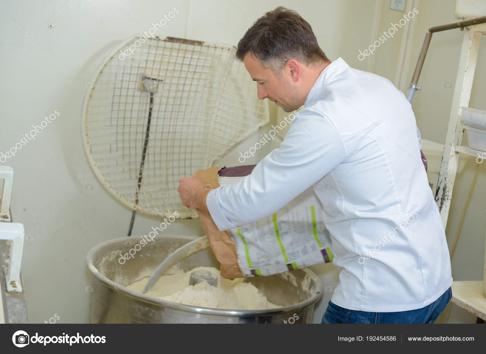 Chef tipping ingredient into mixer — Stock Photo © photography33 #192454586