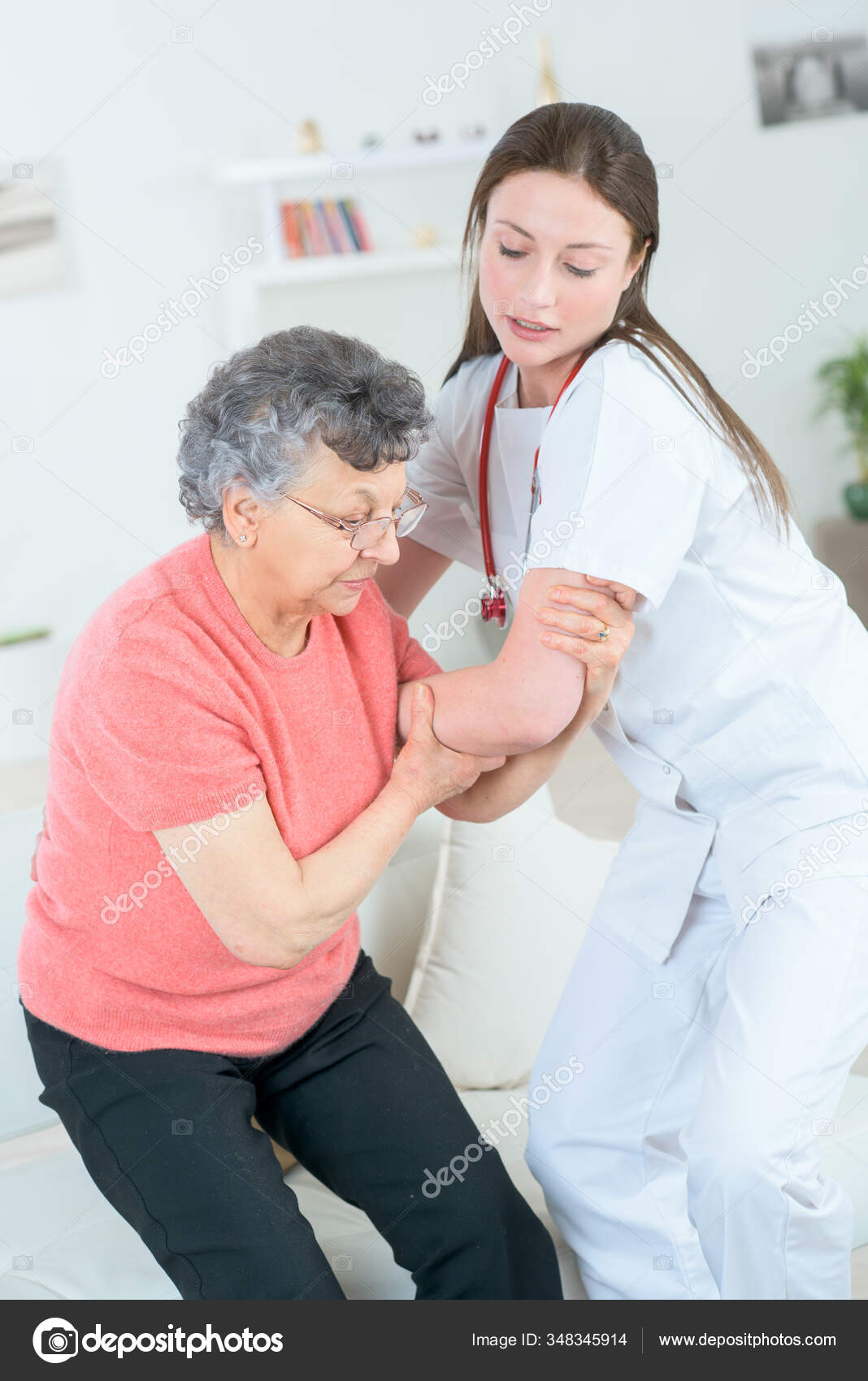 Helping Old Lady Sit Sofa — Stock Photo © photography33 #348345914