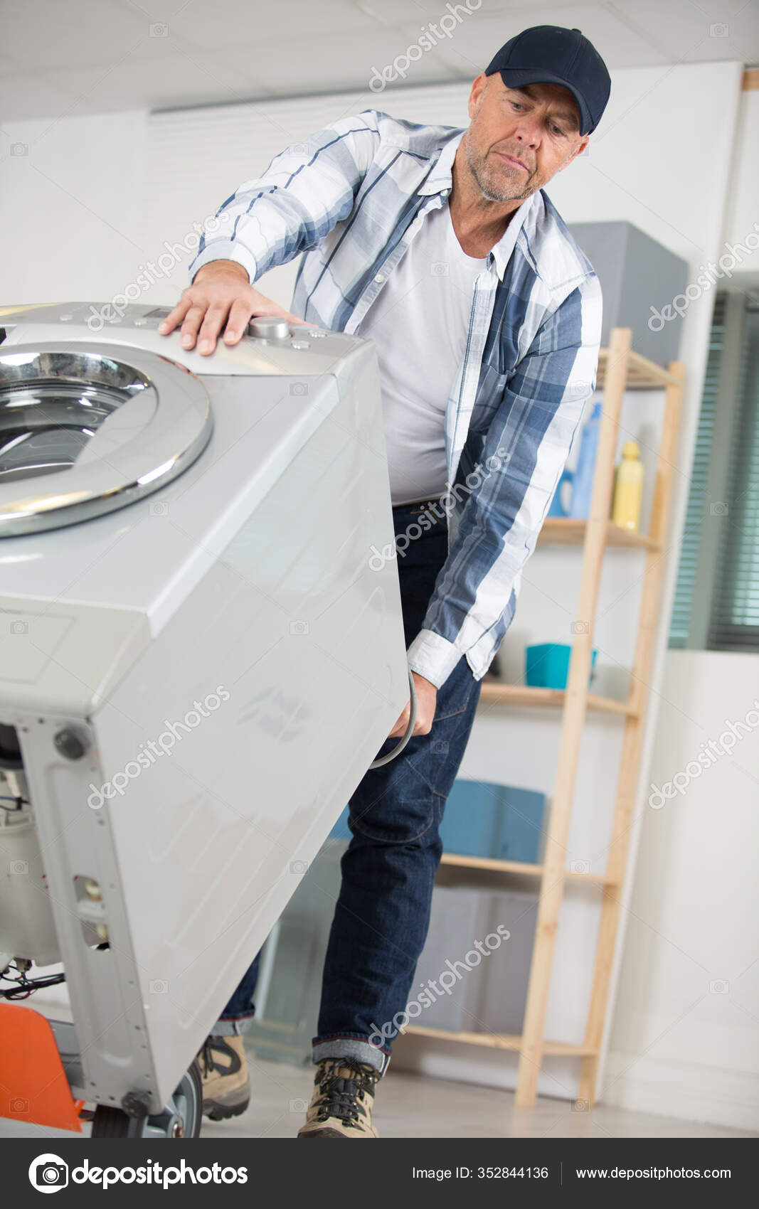 Man Carrying Washing Machine Stock Photo by ©photography33 352844136