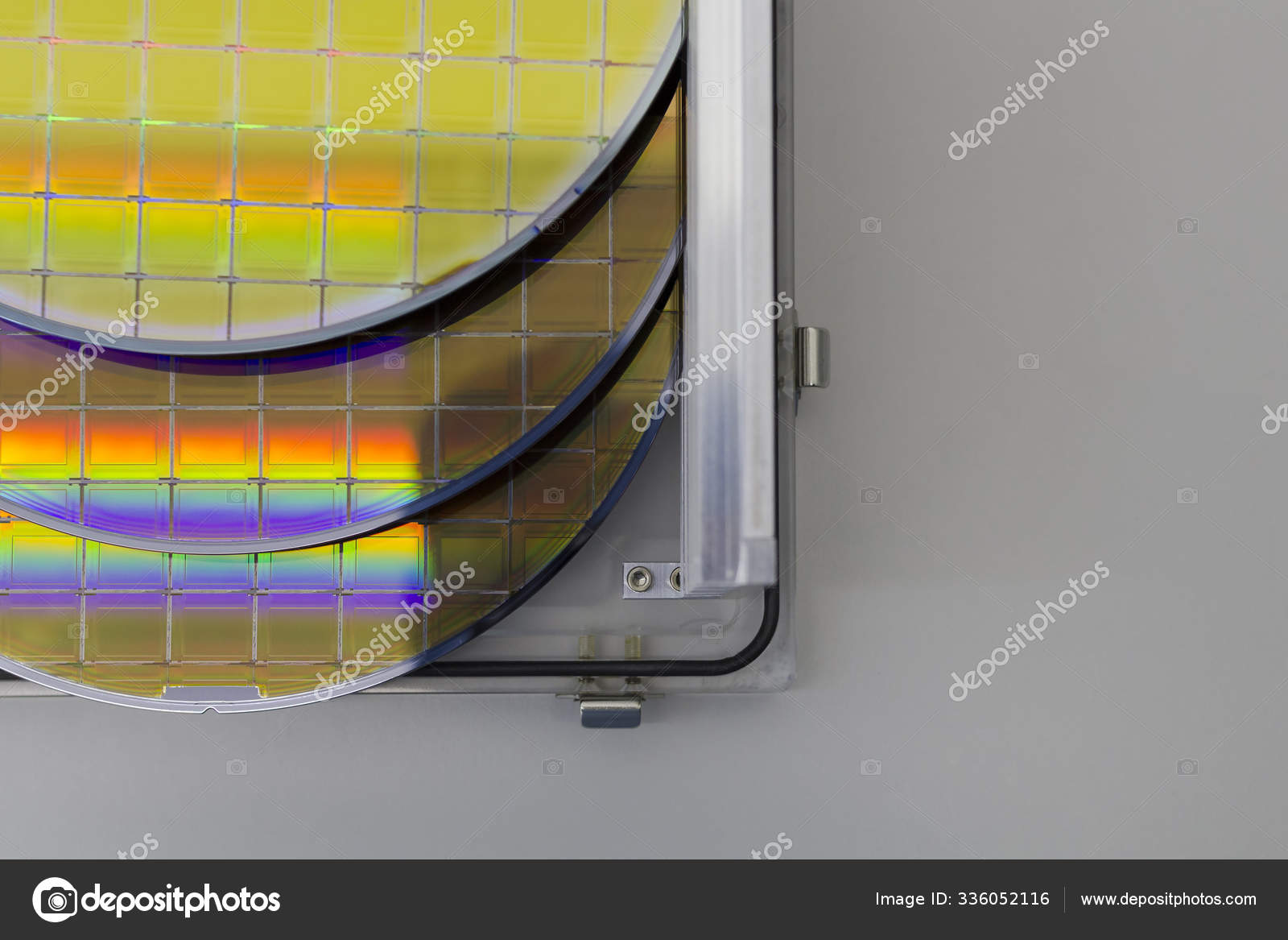 Silicon Wafers in steel holder box on a table- A wafer is a thin slice ...