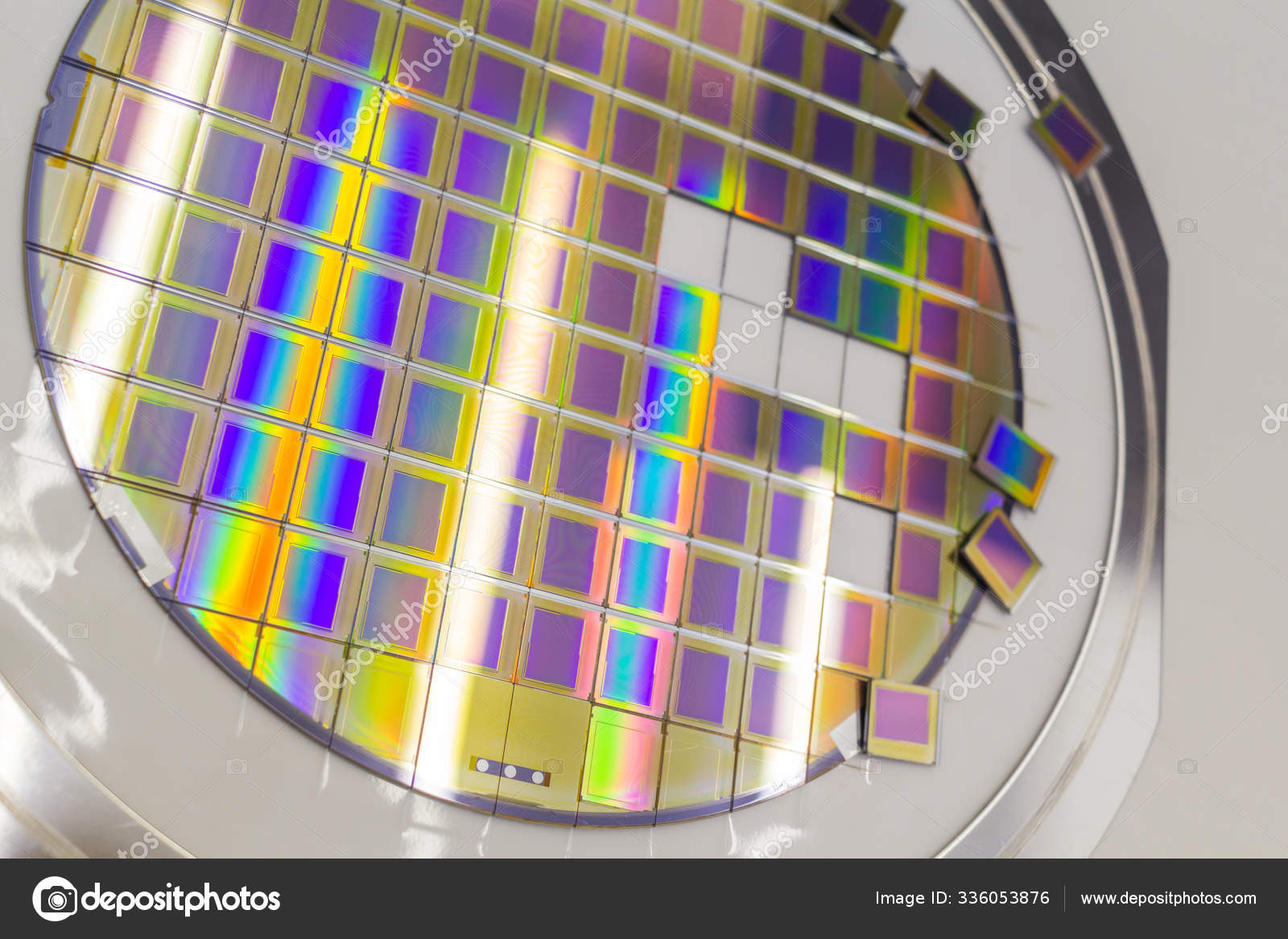 Silicon wafer with microchips fixed in a holder with a steel frame ... Silicon wafer with microchips fixed in a holder with a steel frame ...
